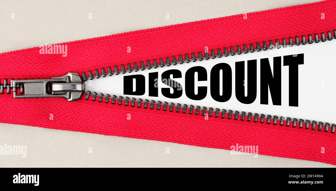 Finance and business concept. On a gray background, a red zipper ...