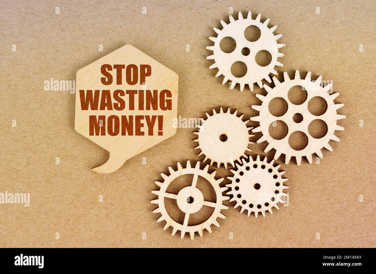 Business and economics concept. On a paper background, gears and a ...