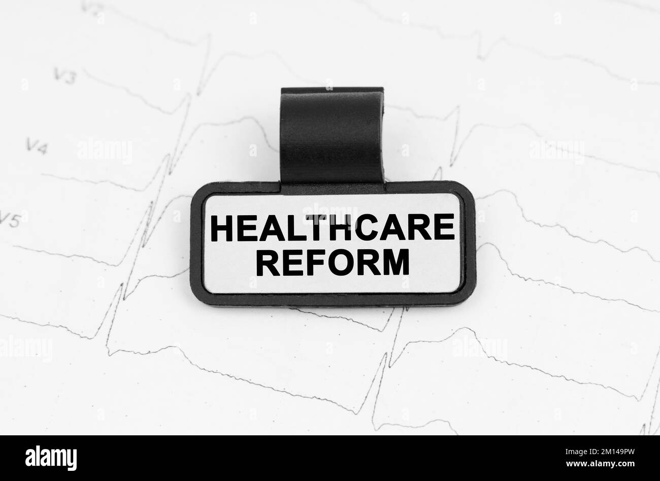 Medicine and health concept. There is a plate on the cardiogram with ...