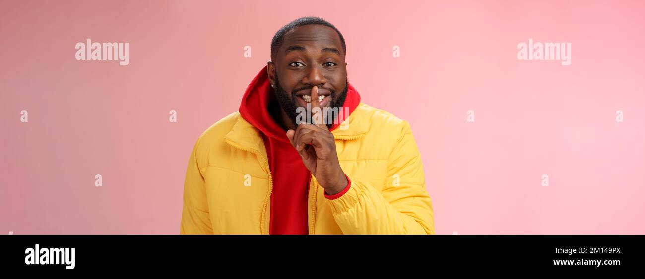 Charming happy young african-american bearded guy in yellow jacket red ...