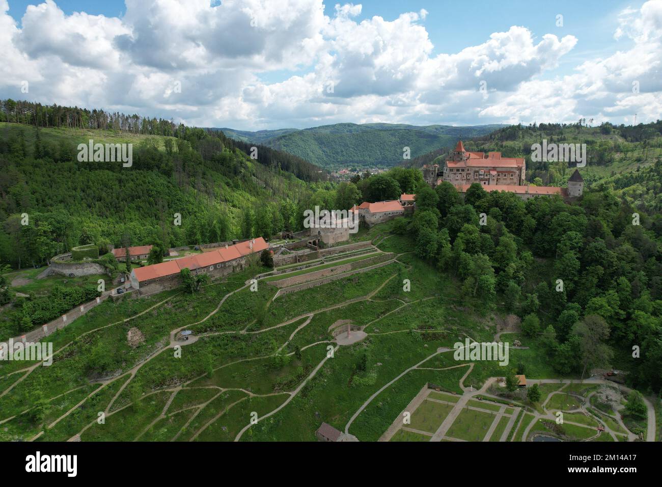 An aerial view of the Pernstejn castle with a cloudy blue sky in the ...