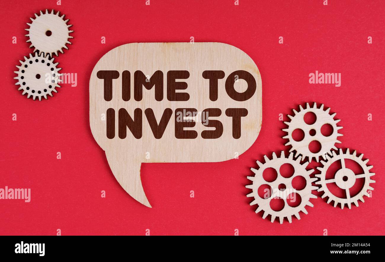 Business and finance concept. On a red background, gears and a thought ...