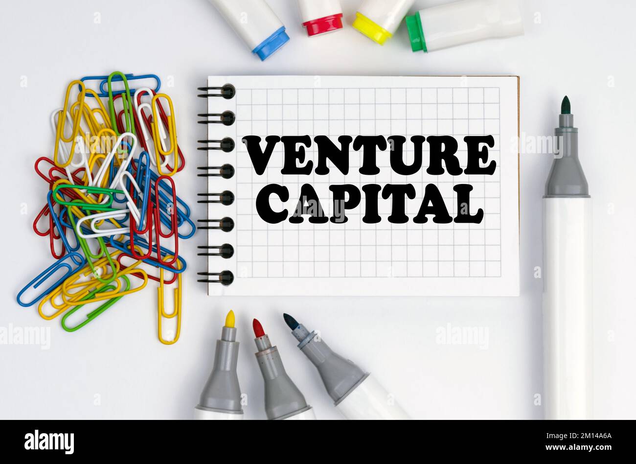 Business and finance concept. On the table are markers, paper clips and ...