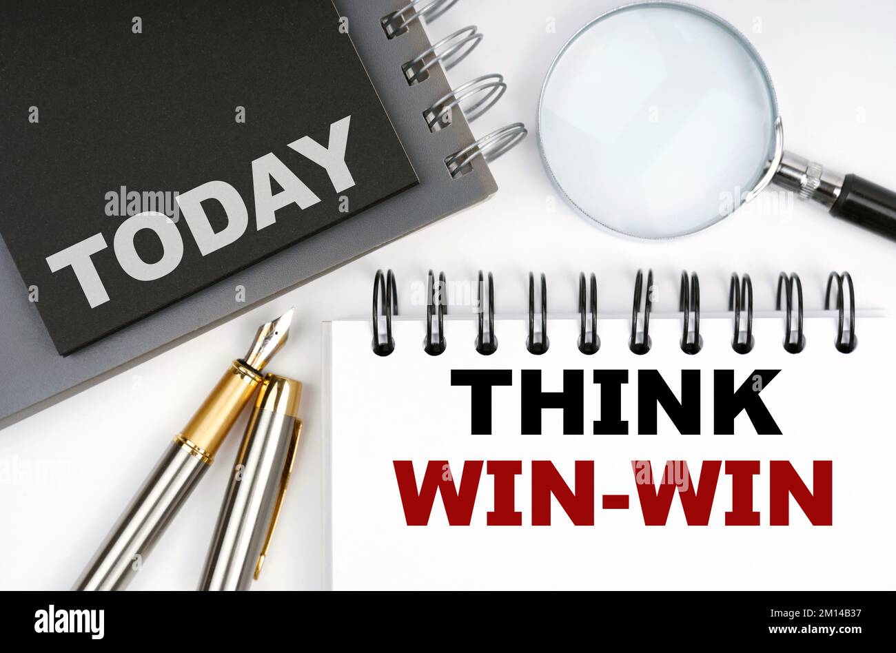 Business and finance concept. On the table are a pen and notebooks with ...