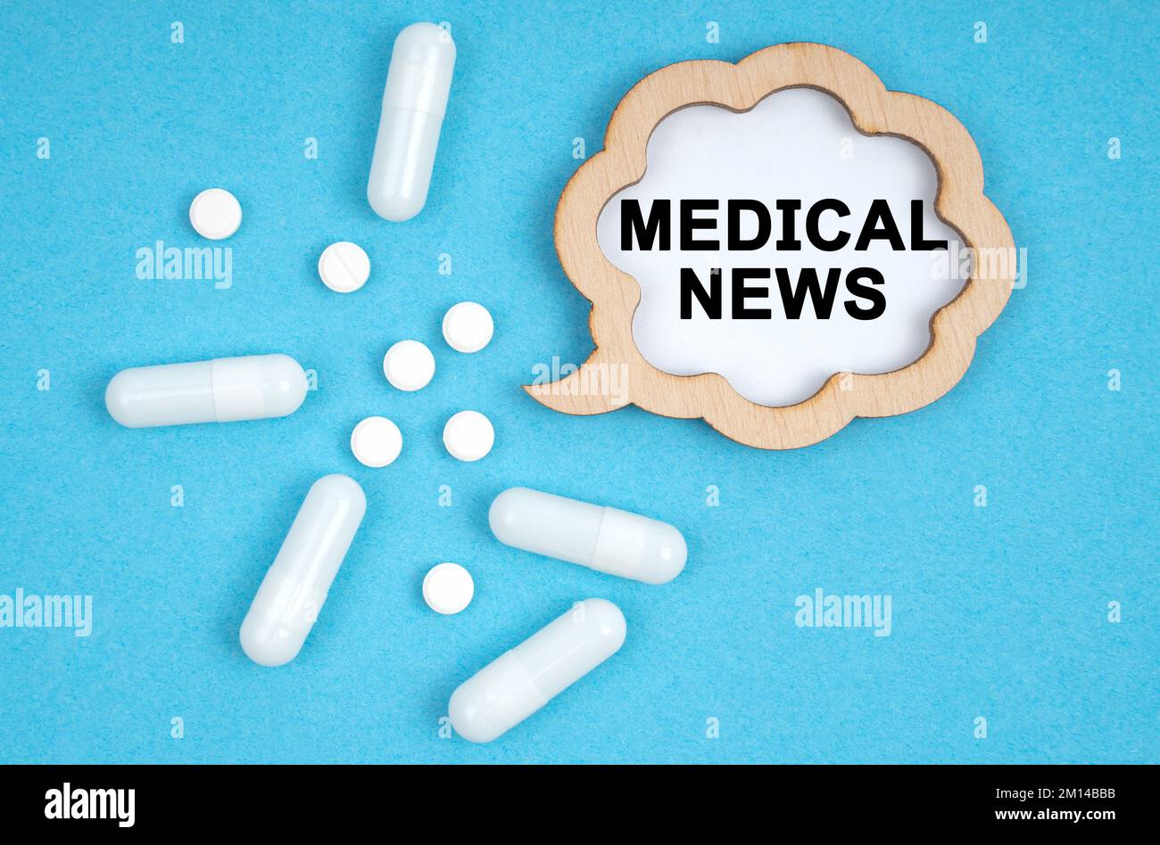 Medicine and health concept. On a blue background, pills and a plate ...