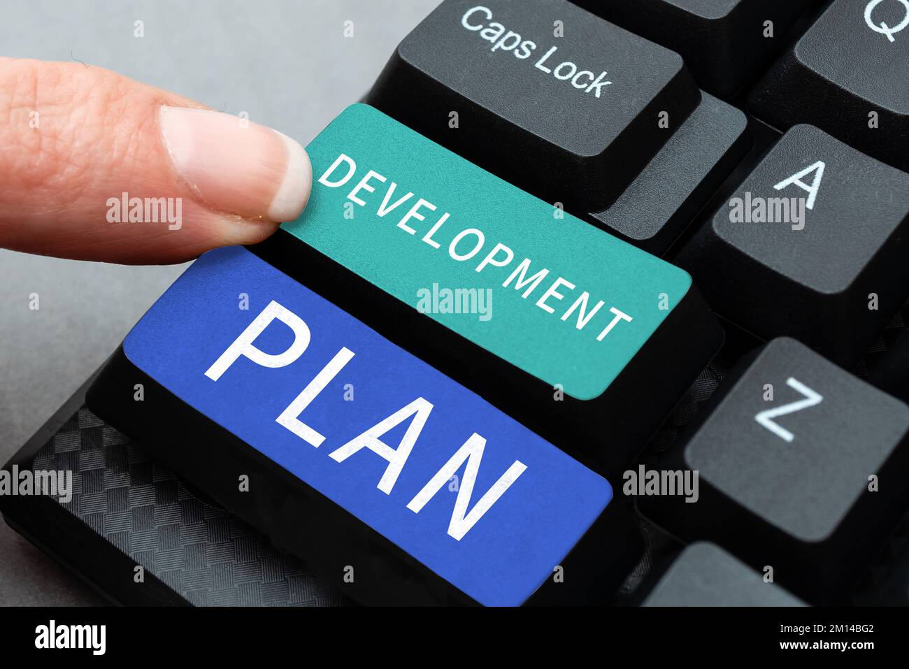 Sign displaying Development Plan. Internet Concept the planning of the ...