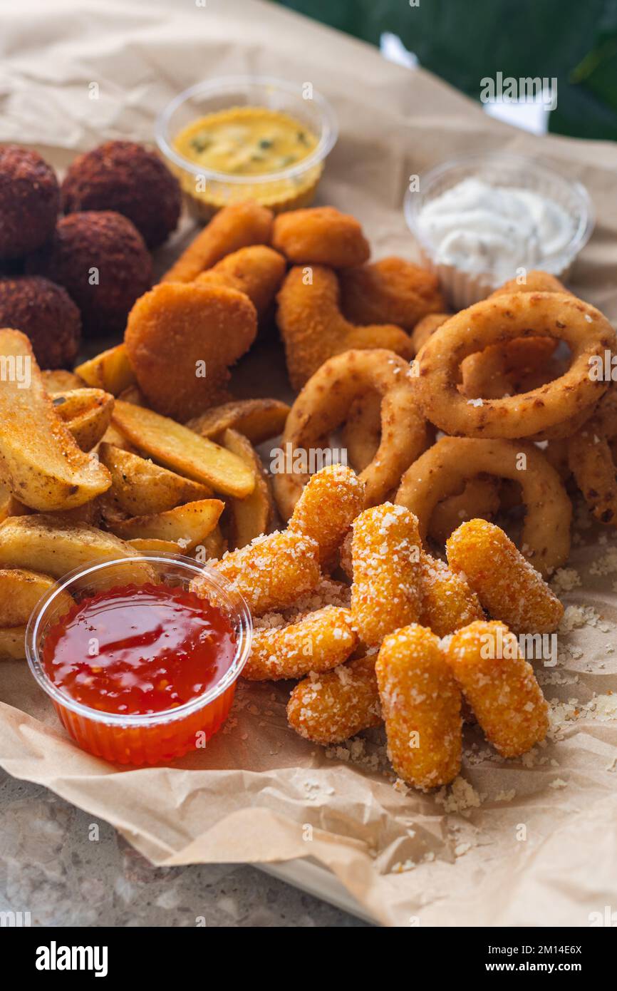 Large set of falafel, rustic potatoes, cheese sticks, chicken nuggets ...