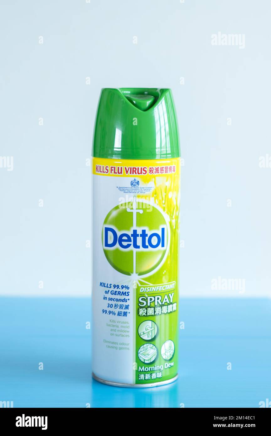 A Dettol Disinfectant Spray bottle isolated on blue and white ...