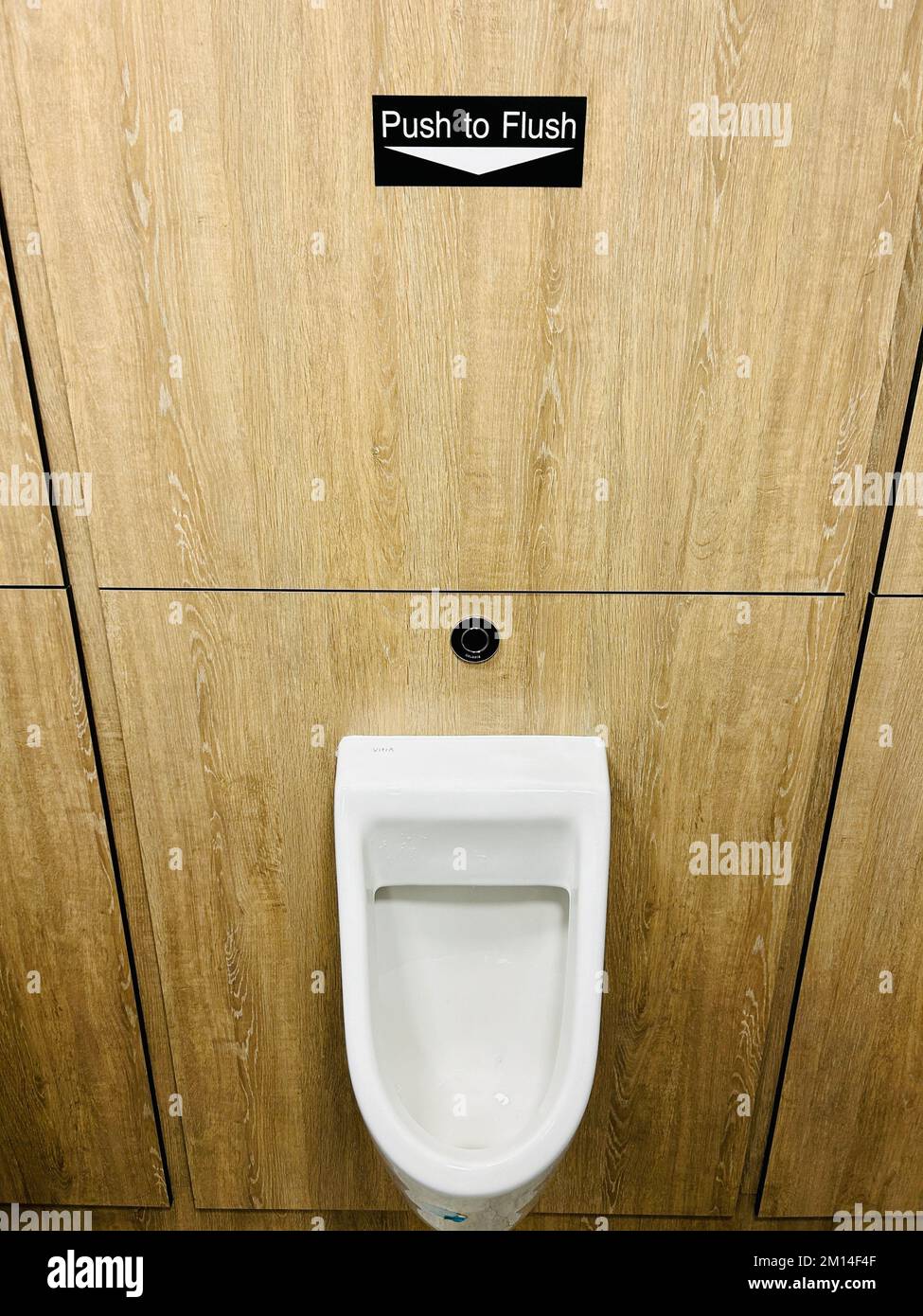 Push to Flush urinals in men's toilets for water saving and efficiency ...