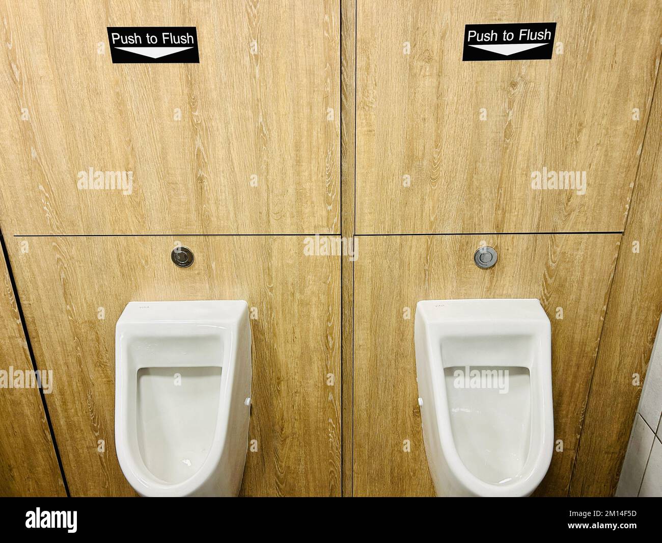 Push to Flush urinals in men's toilets for water saving and efficiency ...