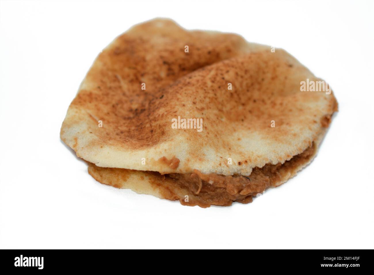 Shami Syrian pita bread with mashed fava beans mixed with oil, sesame ...