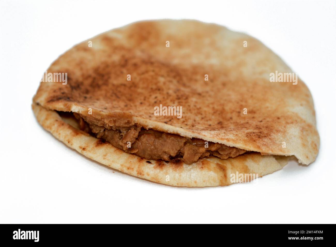 Shami Syrian pita bread with mashed fava beans mixed with oil, sesame ...