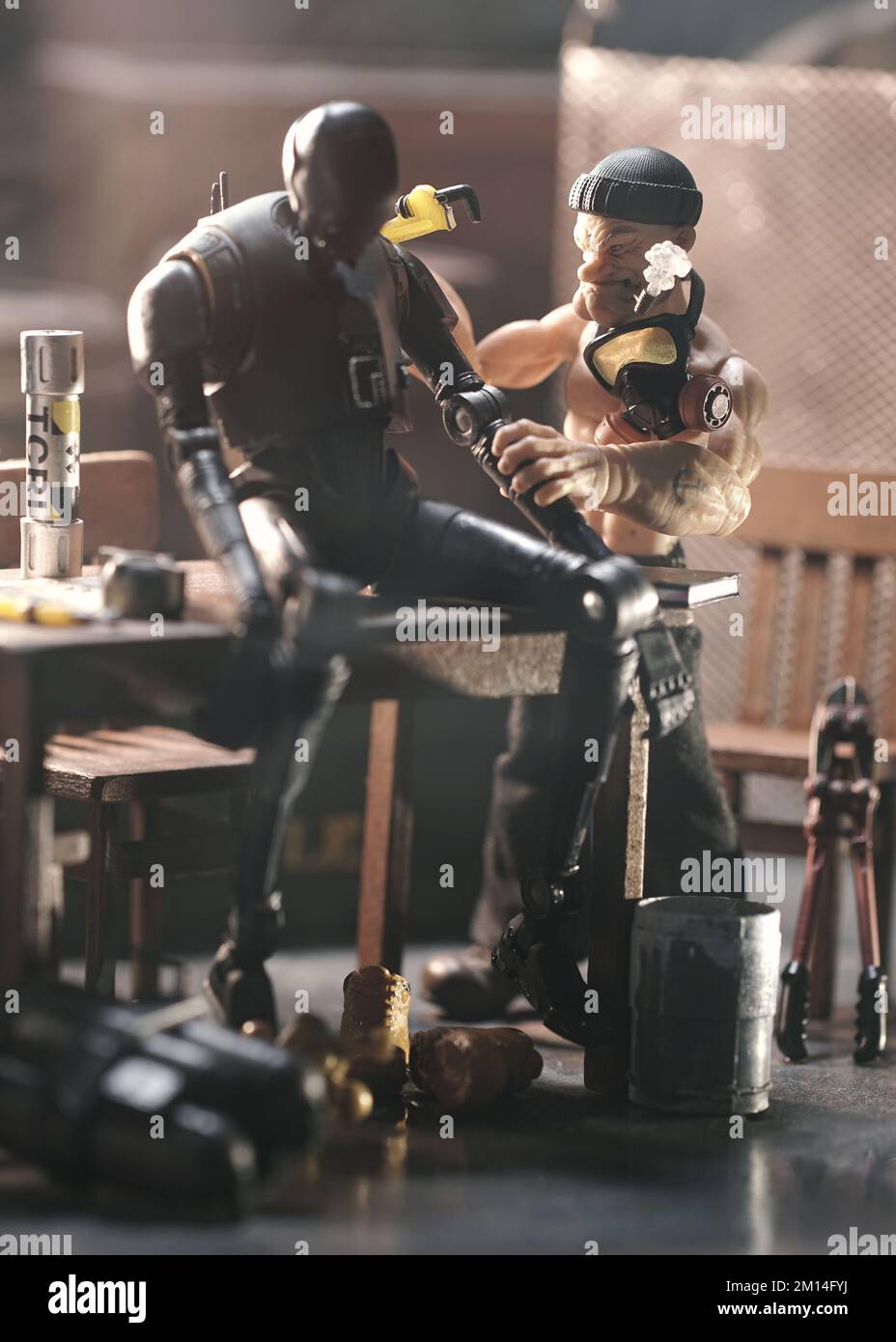 A vertical closeup of Popeye figurine repairing a metallic figurine in ...