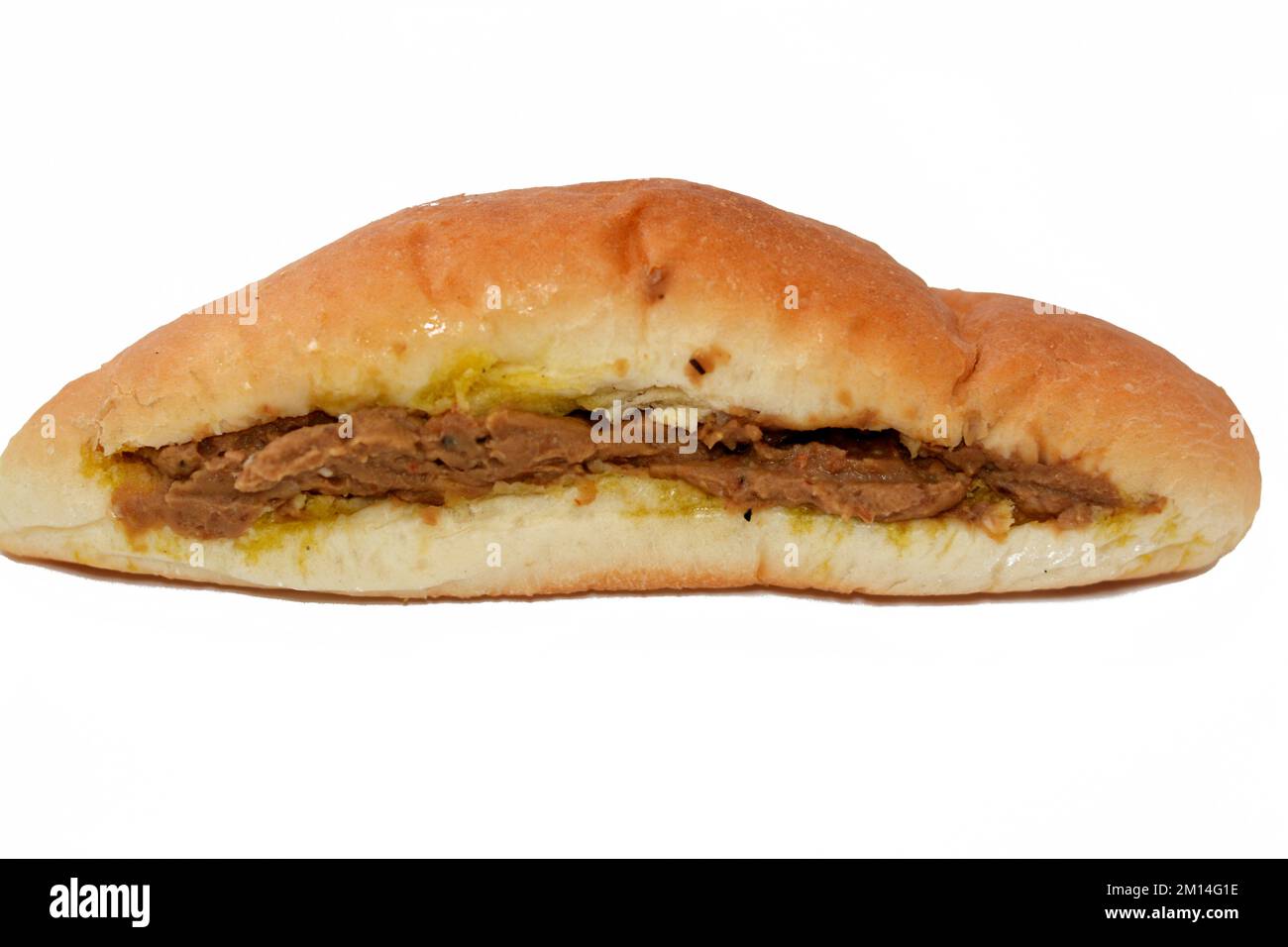 French Fino bun bread with mashed fava beans mixed with oil, sesame ...