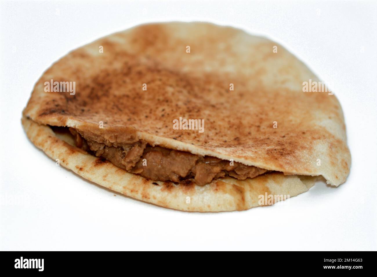 Shami Syrian pita bread with mashed fava beans mixed with oil, sesame ...