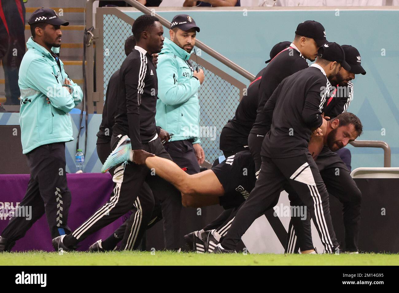 Al Daayen, Qatar. 09th Dec, 2022. Pitch invader Vitaly Zdorovetskiy is ...