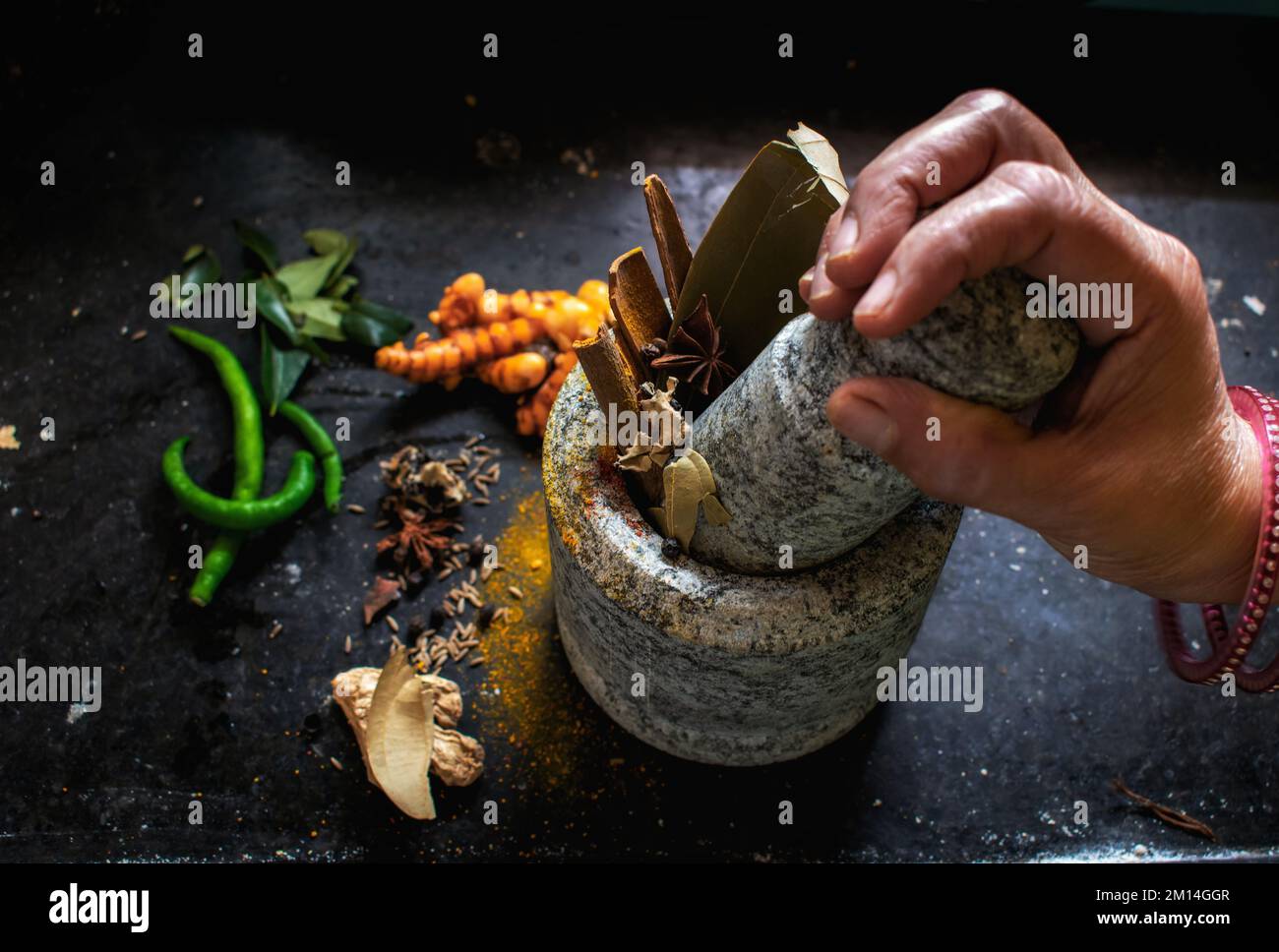 Picture of a masala pot where tasty and healthy spices are being ...