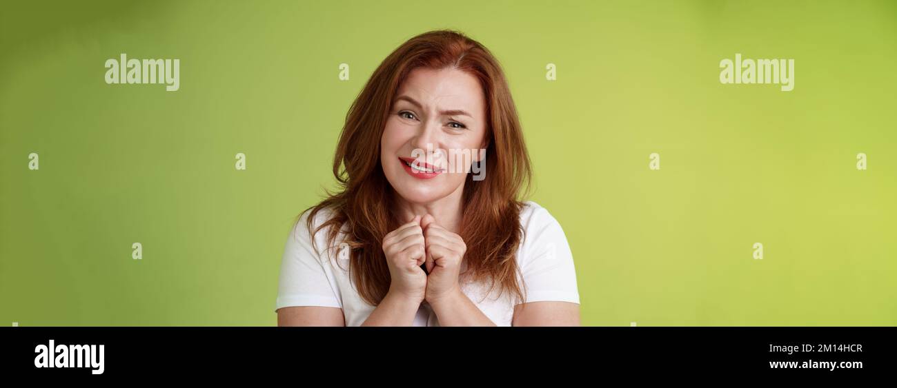 Silly touched tender redhead charmed middle-aged woman sighing gladly ...