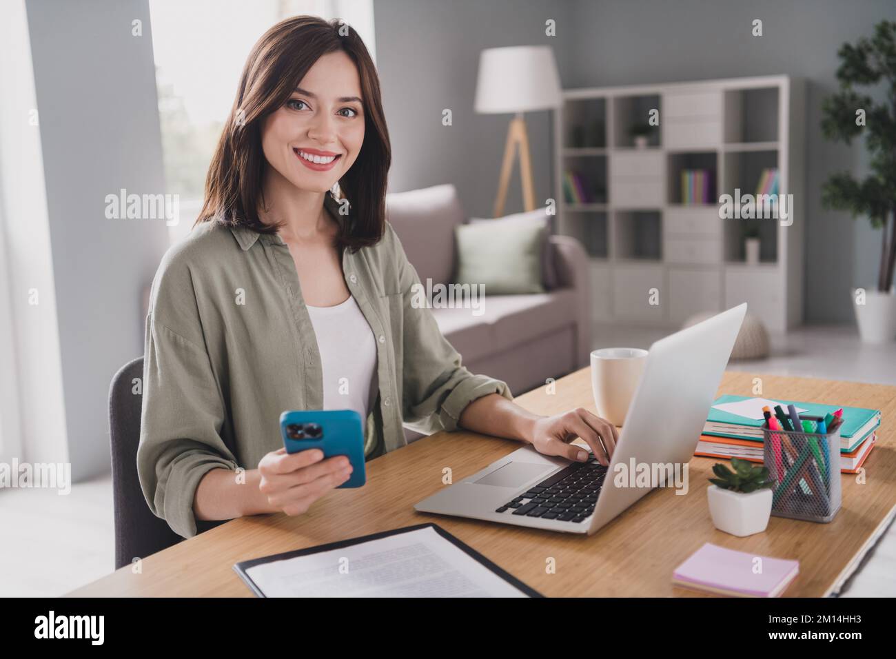 Photo of joyful pretty charming successful lady boss ceo sitting table ...
