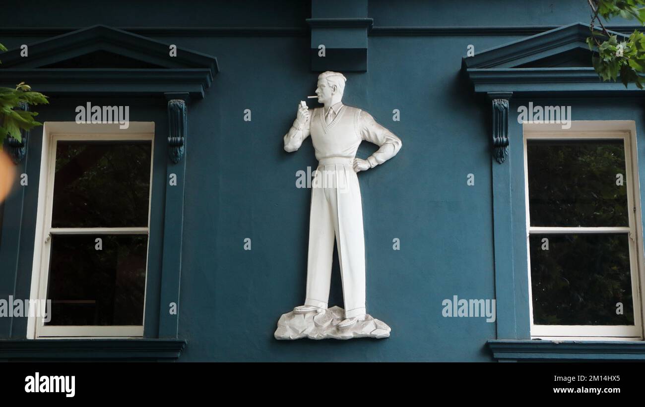 Smoking man figure sculpture on a building wall Melbourne Australia ...