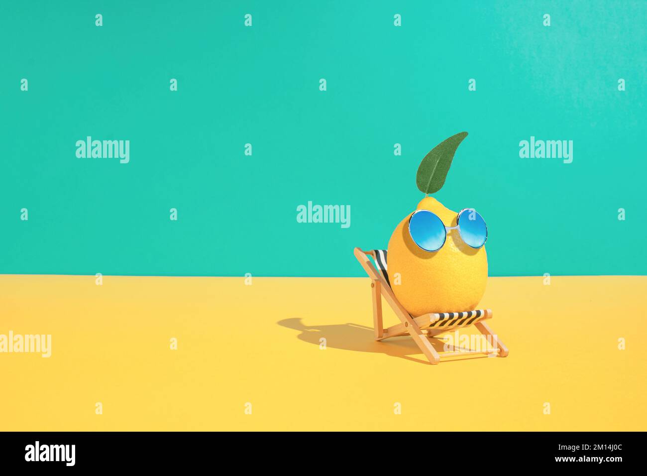 A 3D yellow lemon chilling on beach on pastel green background - summer ...