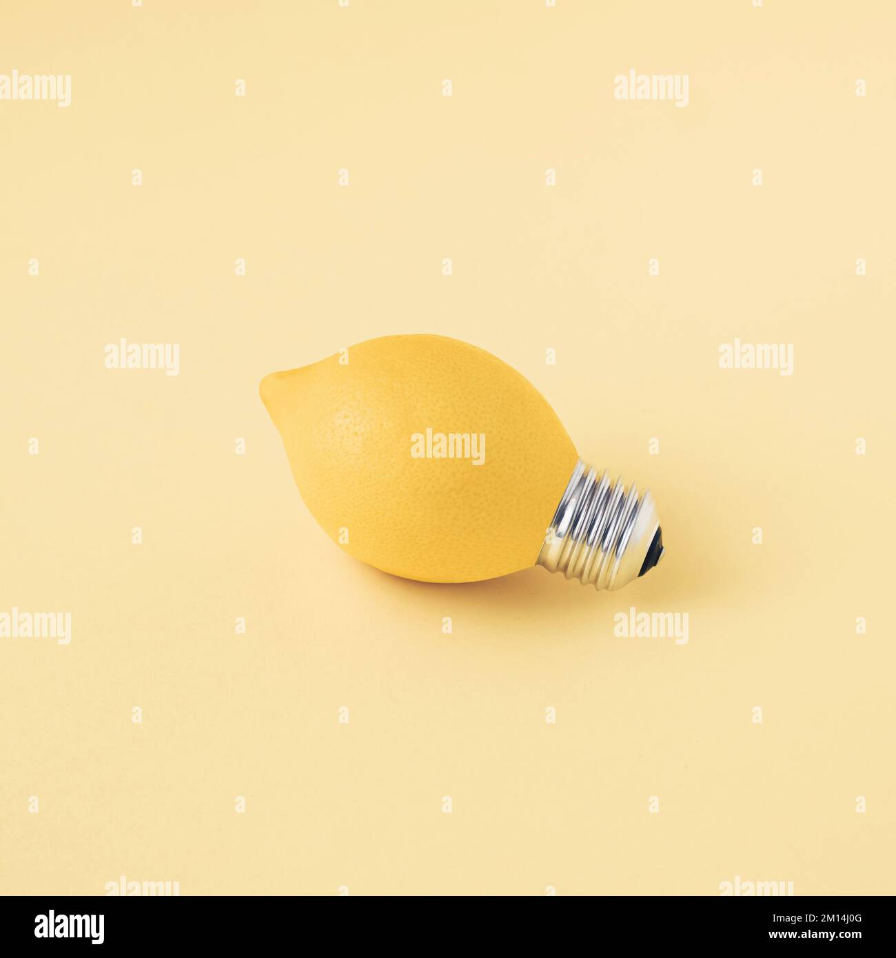A 3D yellow lemon light bulb on pastel blue background - summer concept ...