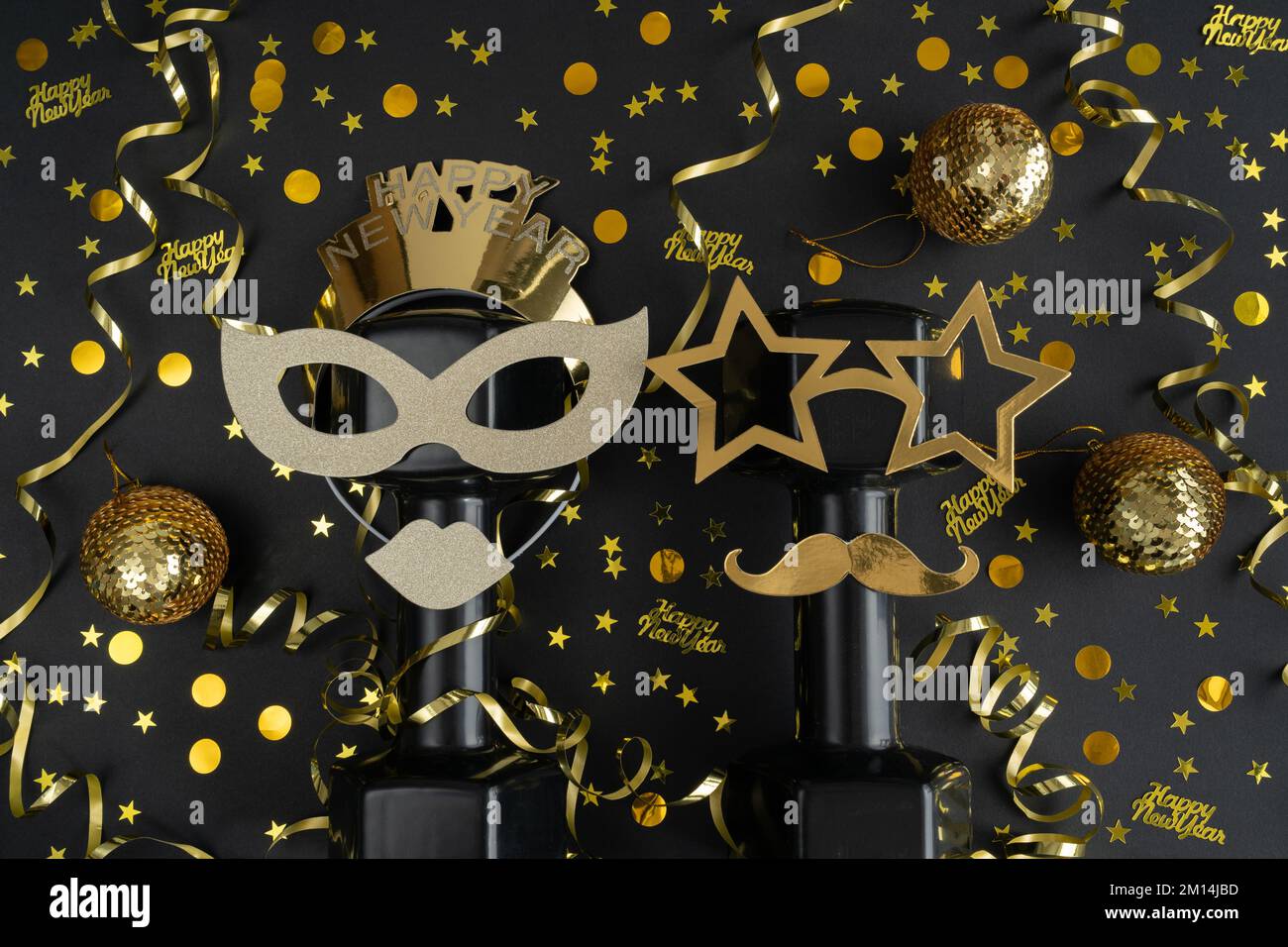 Two dumbbells dressed up for New Year's Eve celebration party or ...
