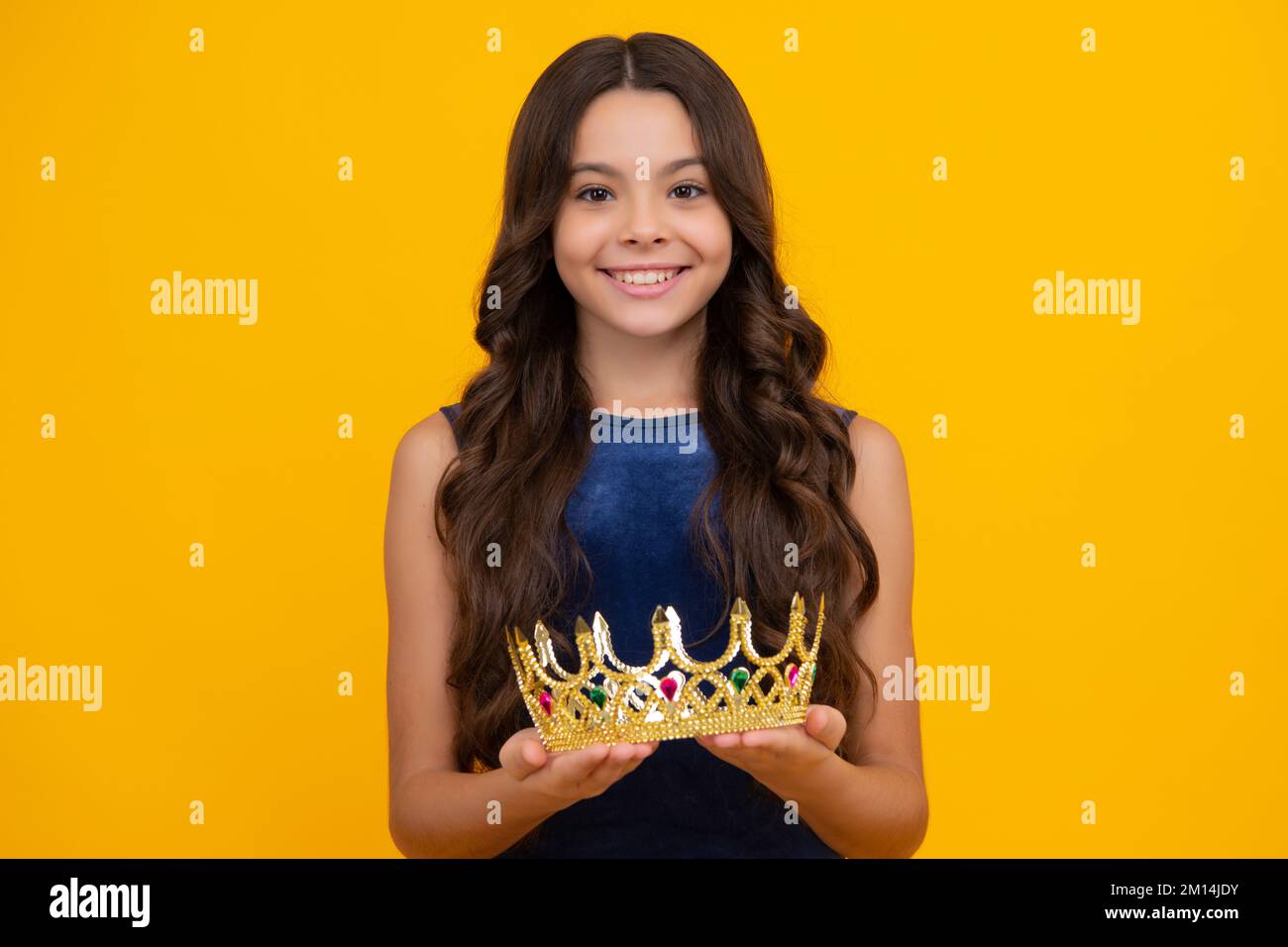 Portrait of ambitious teenage girl with crown, feeling princess ...