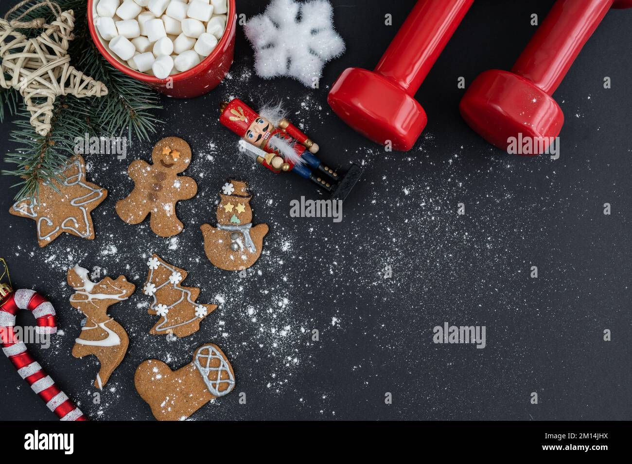Homemade gingerbread Christmas cookies, gym dumbbells, hot chocolate ...