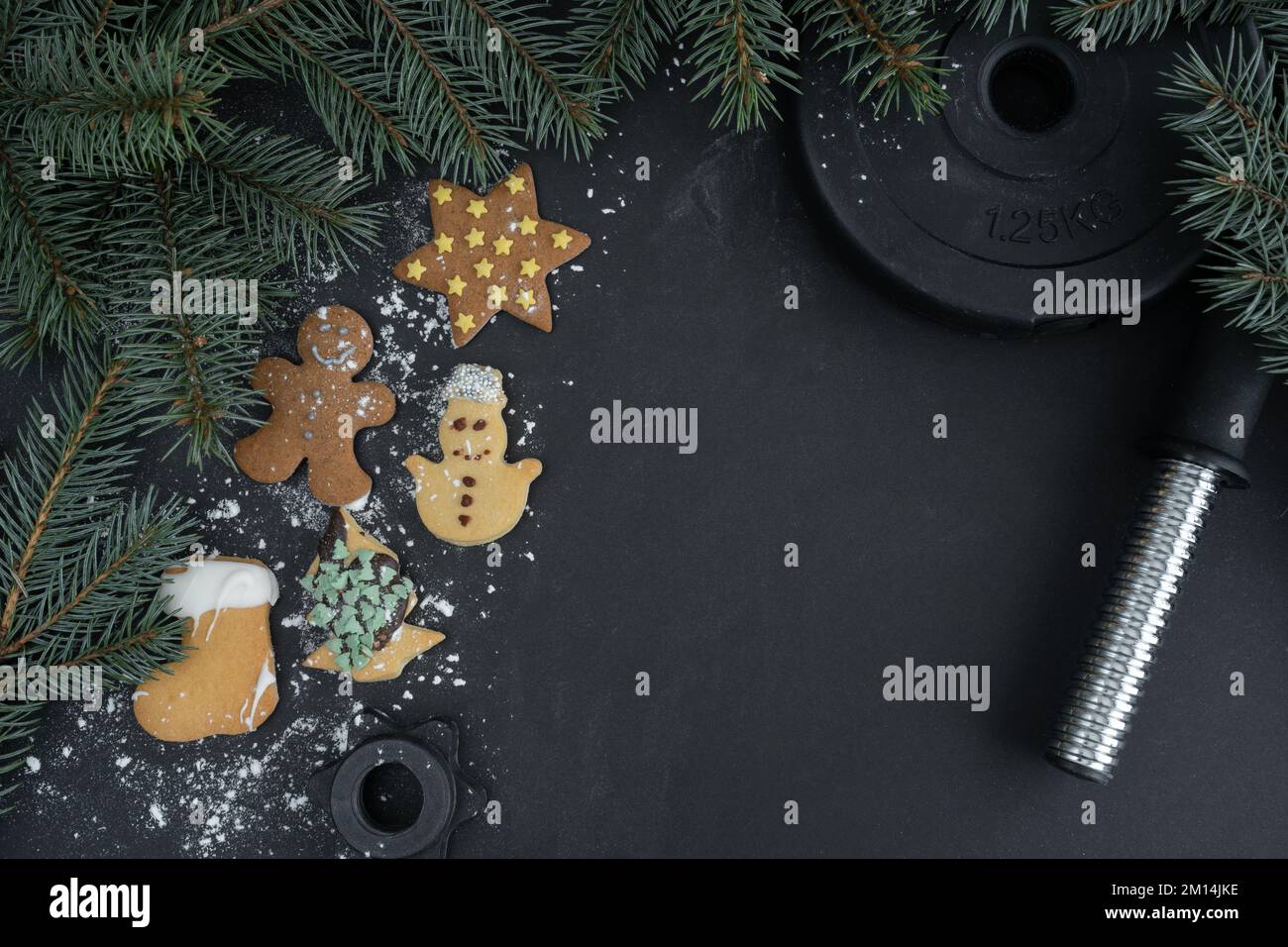 Gym dumbbell weight plate, gingerbread cookies, Christmas tree branches ...