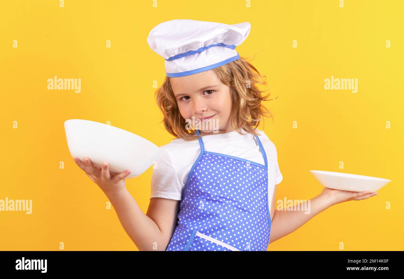 Funny kid chef cook with kitchen plate, studio portrait. Kid chef cook ...