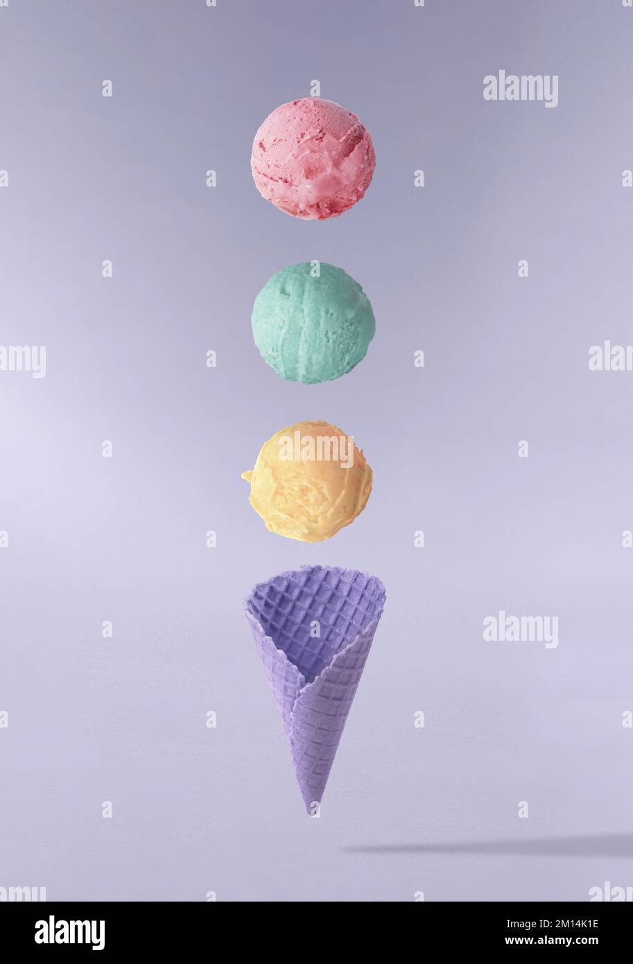 A 3D vertical of an ice cream cone with colorful balls of ice cream ...