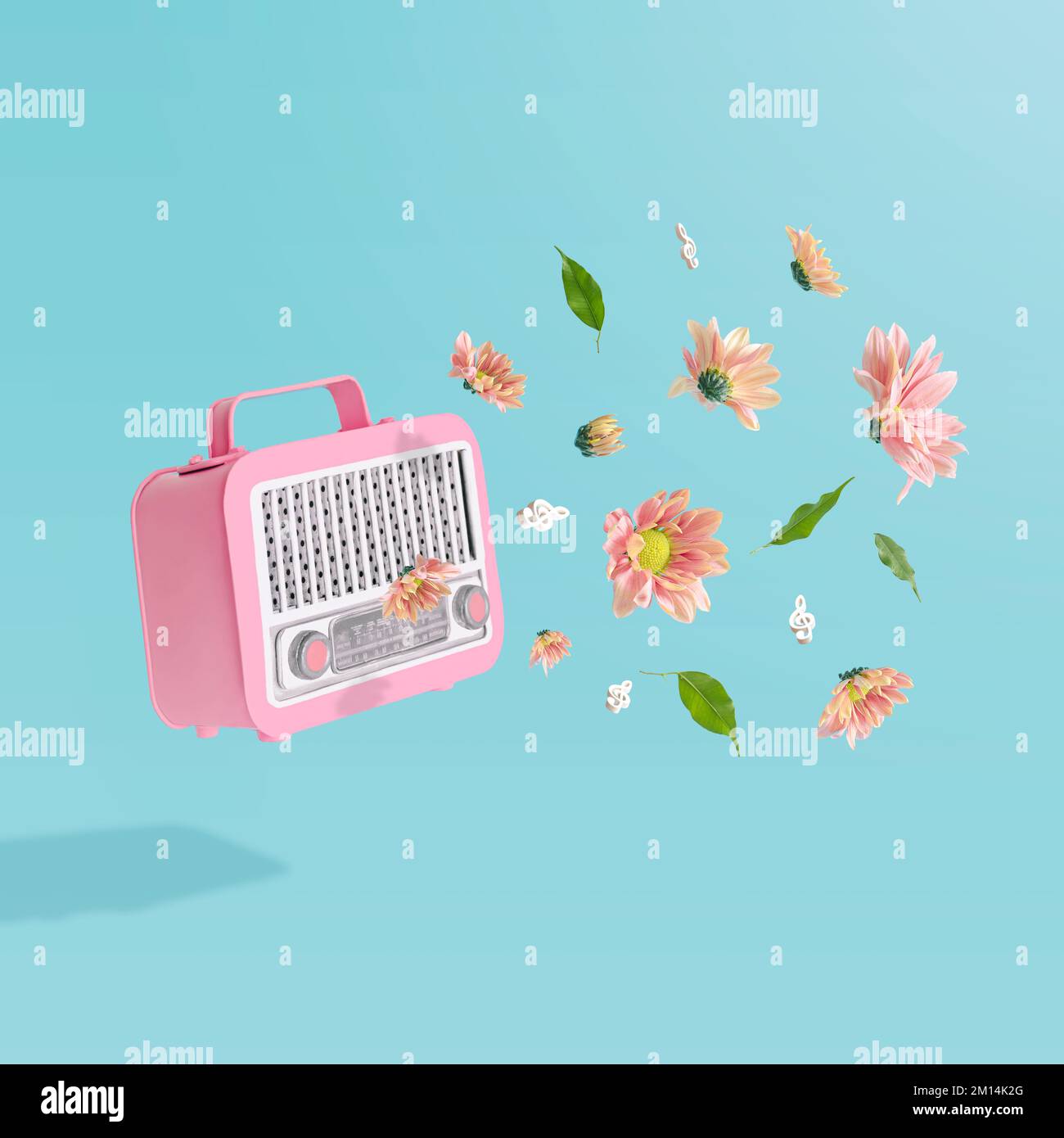 A 3D of a pink vintage radio receiver with colorful summer flowers on a ...