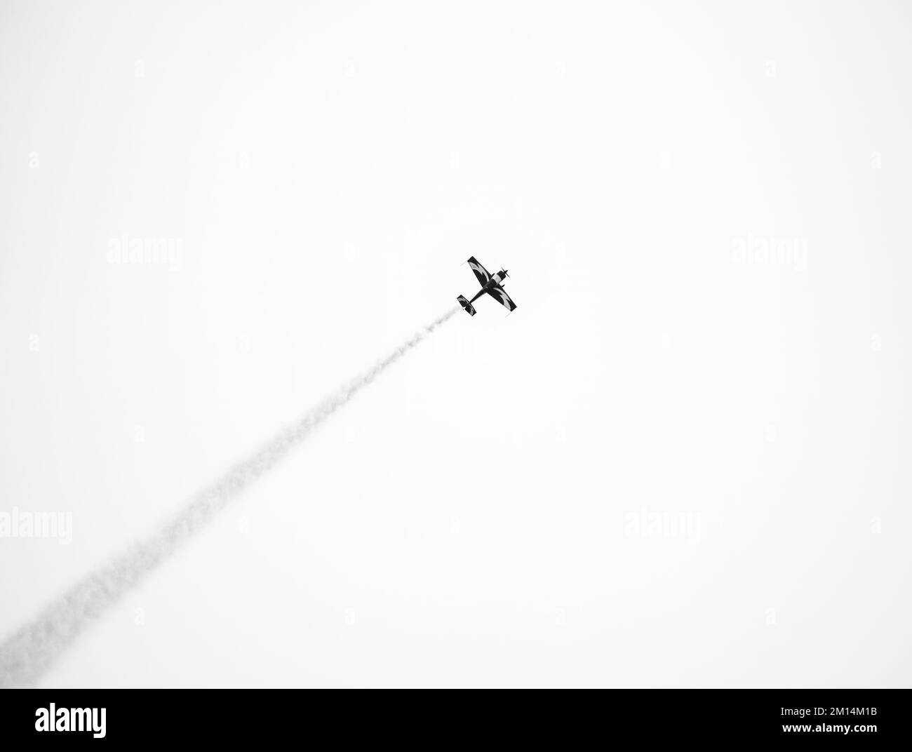 Minimalist picture with an acrobatic aircraft light airplane leaving ...