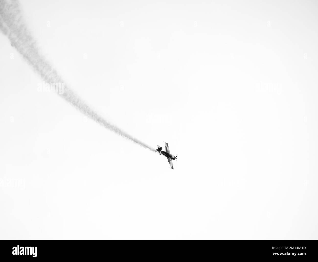 Minimalist picture with an acrobatic aircraft light airplane leaving ...