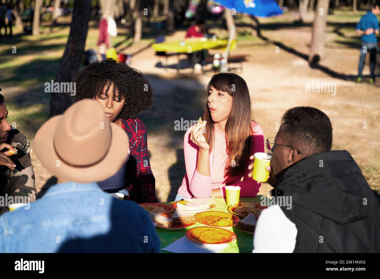 Young man sitting picnic table hi-res stock photography and images - Alamy