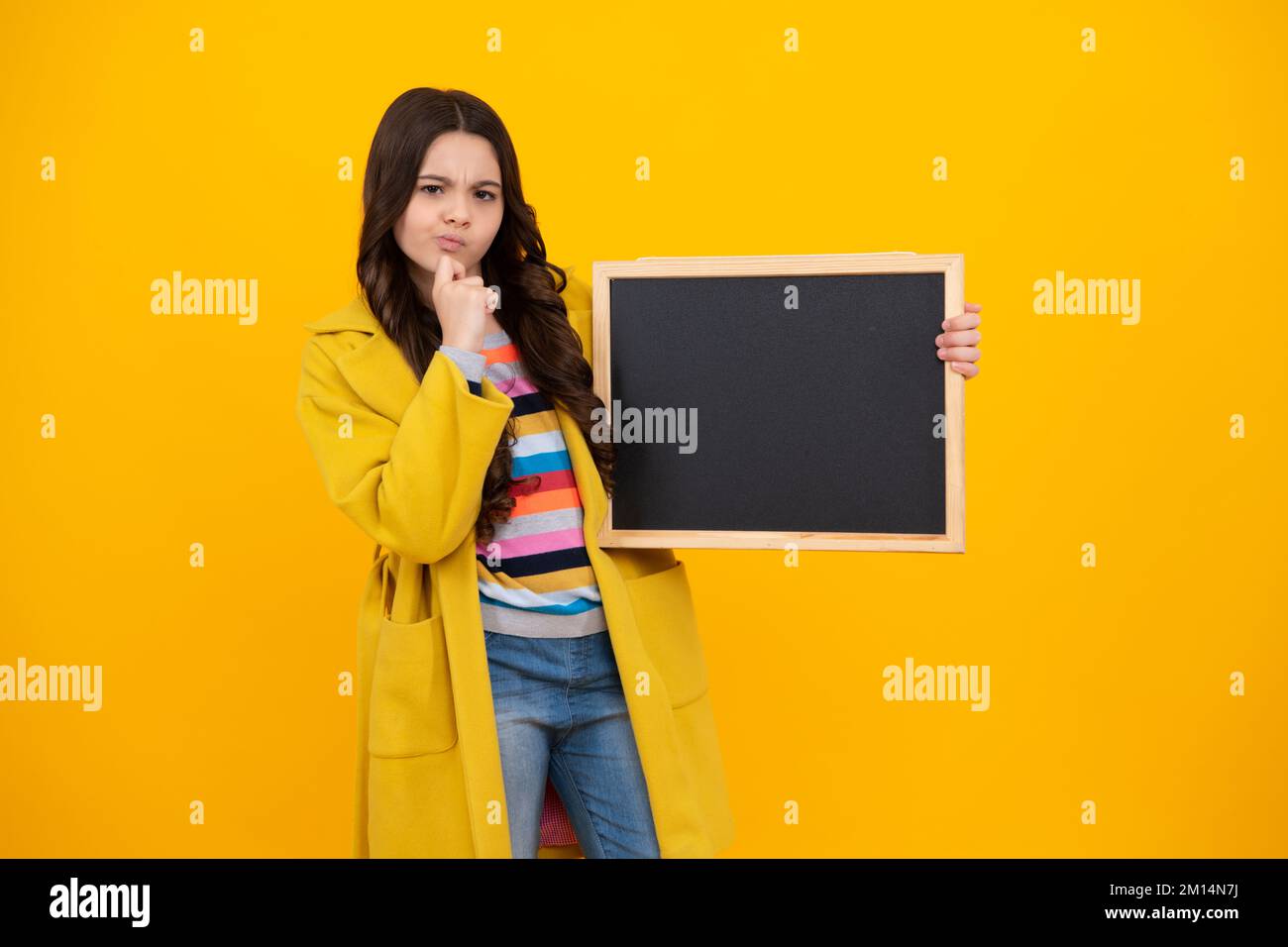 Teenager child holding blank chalkboard for message Isolated on a ...