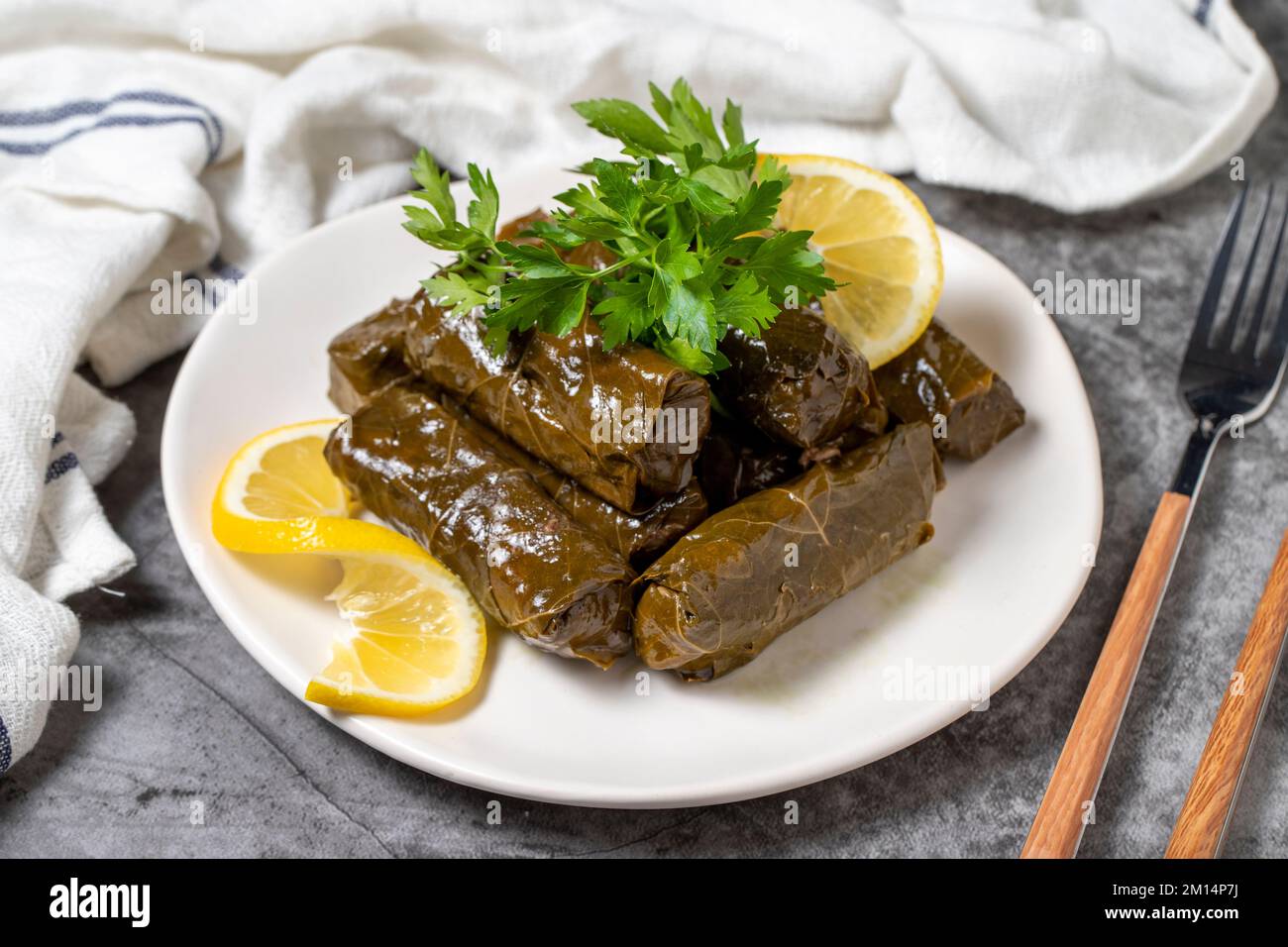 Stuffed leaves with olive oil or dolma on a dark background. Turkish ...