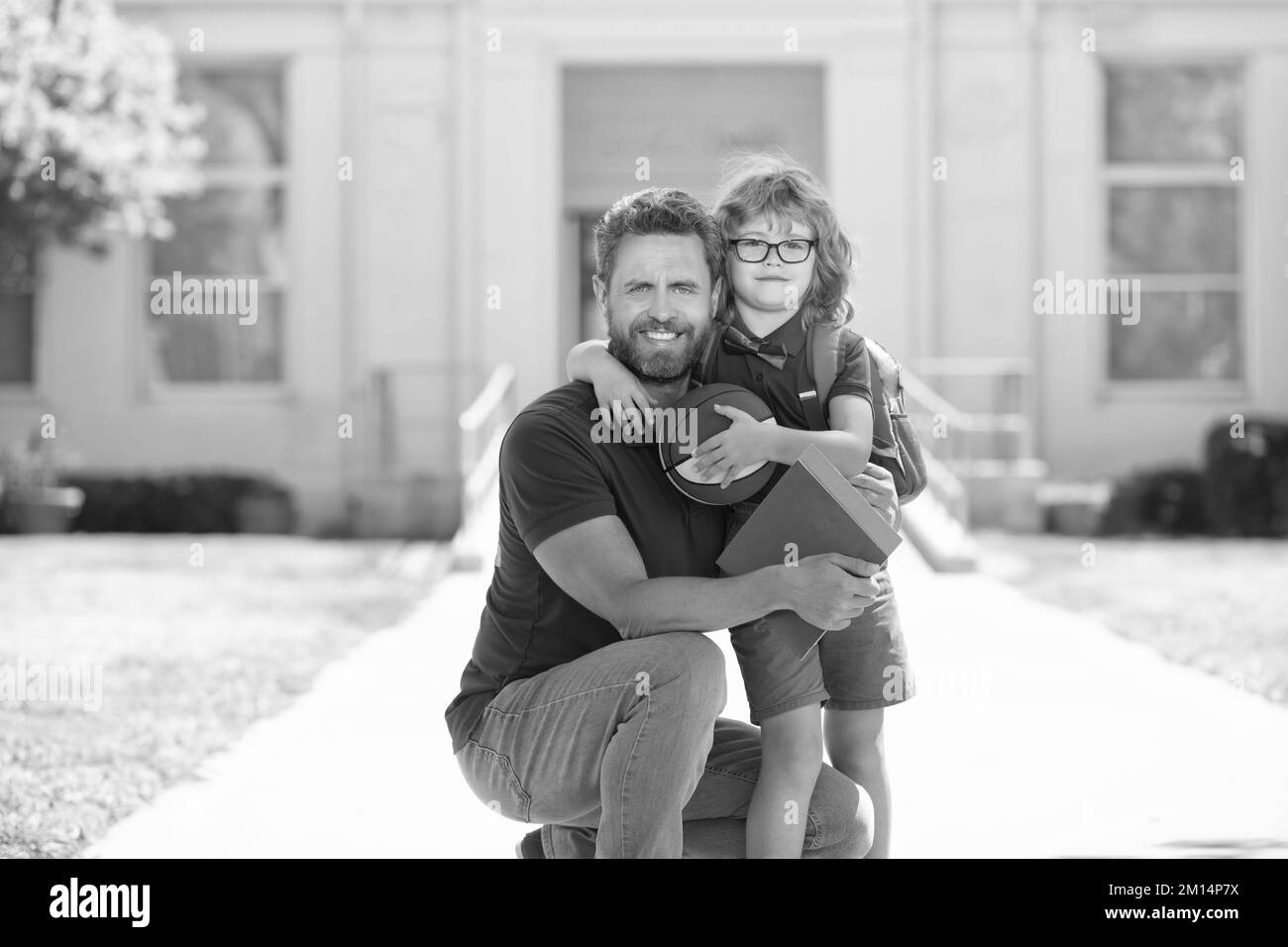 father and son come back from school. happy family values. childhood ...