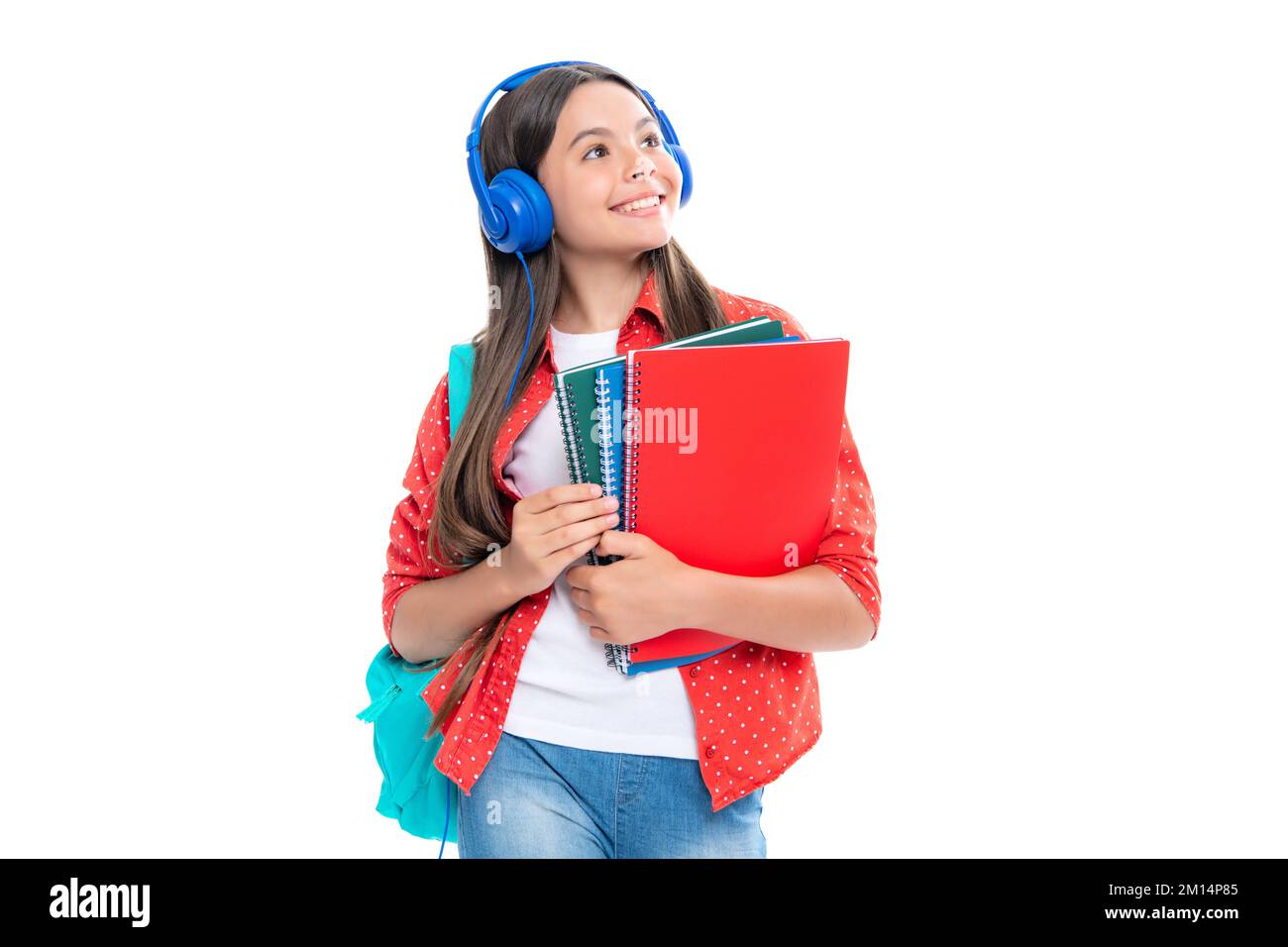 School girl, teenage student in headphones and books on isolated studio ...