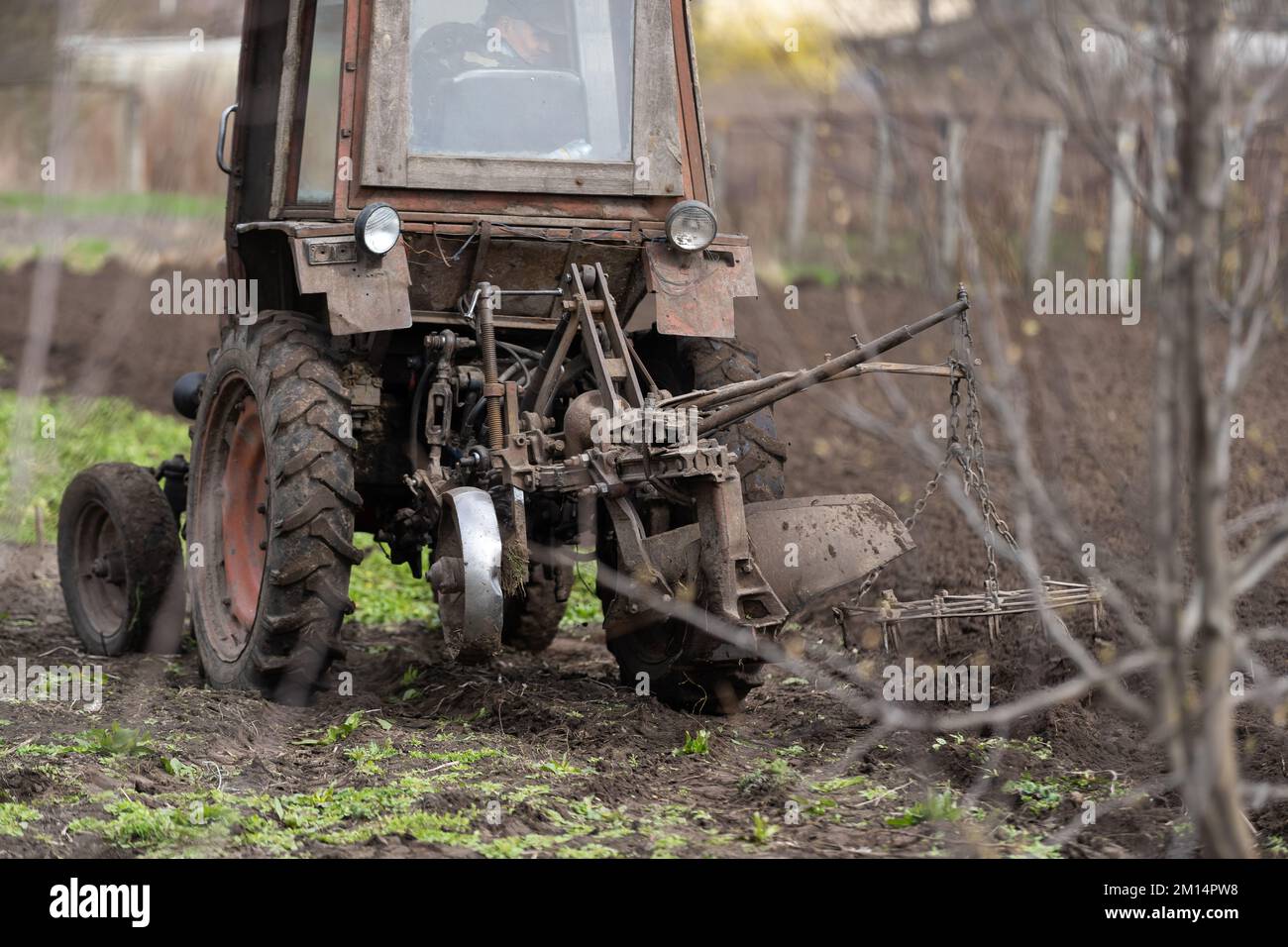 Old Belarus tractor on a ground Stock Photo - Alamy