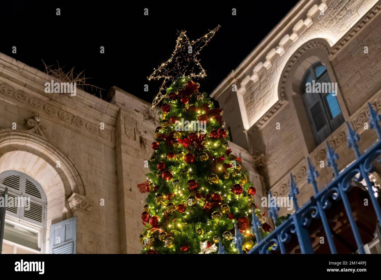A decorated Christmas tree displayed outside Saint Louis French ...