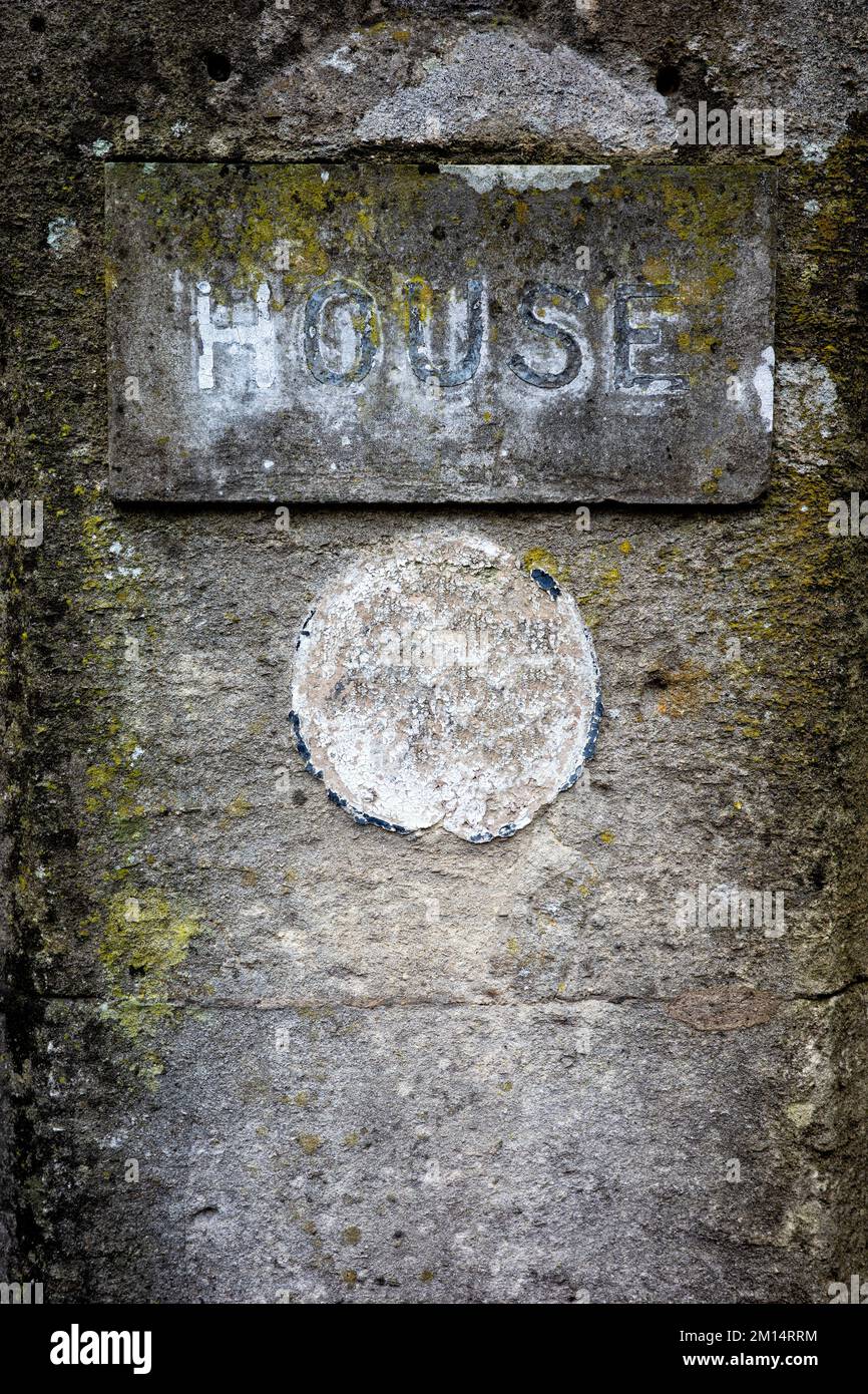 Missing house number on a stone wall Stock Photo - Alamy