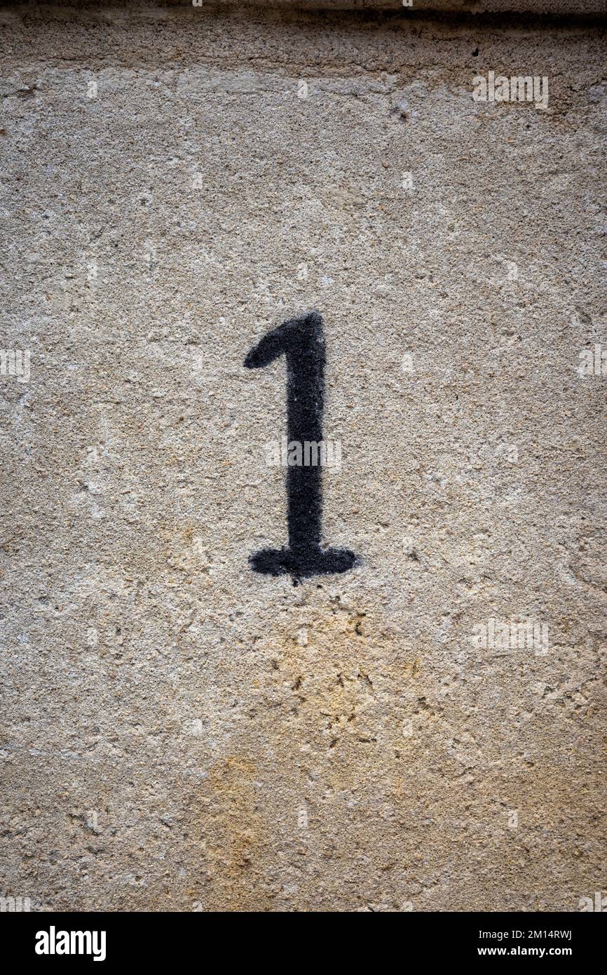 Number 1 painted on a stone wall Stock Photo - Alamy