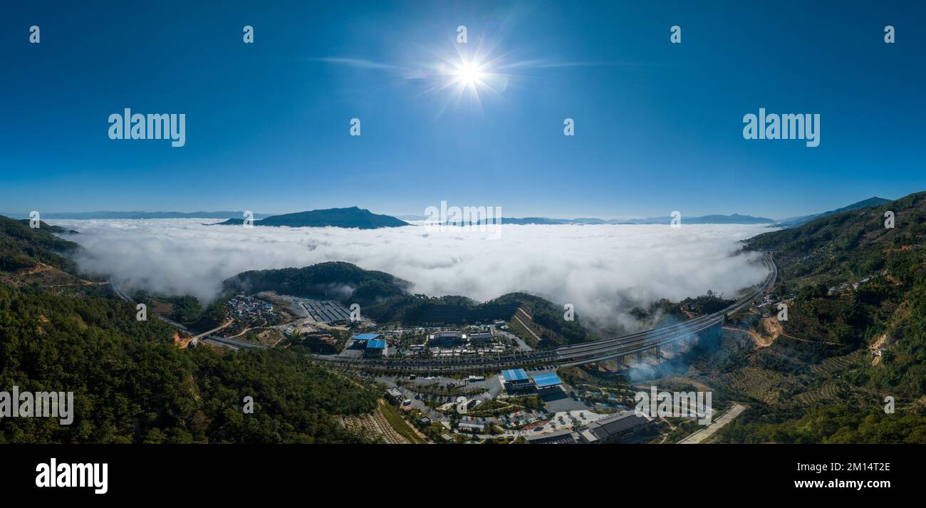 Lincang. 10th Dec, 2022. This aerial panoramic photo taken on Dec. 10 ...