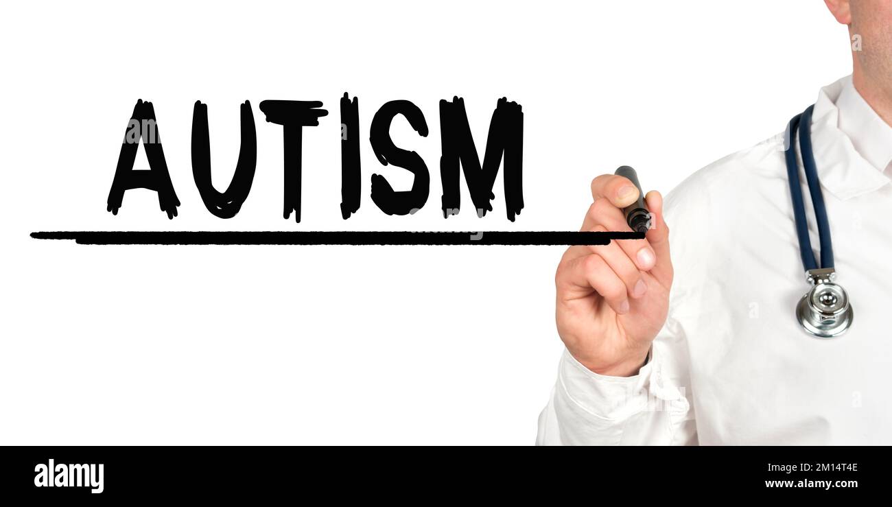 Medicine concept. Doctor writes the word - AUTISM. Image of a hand ...