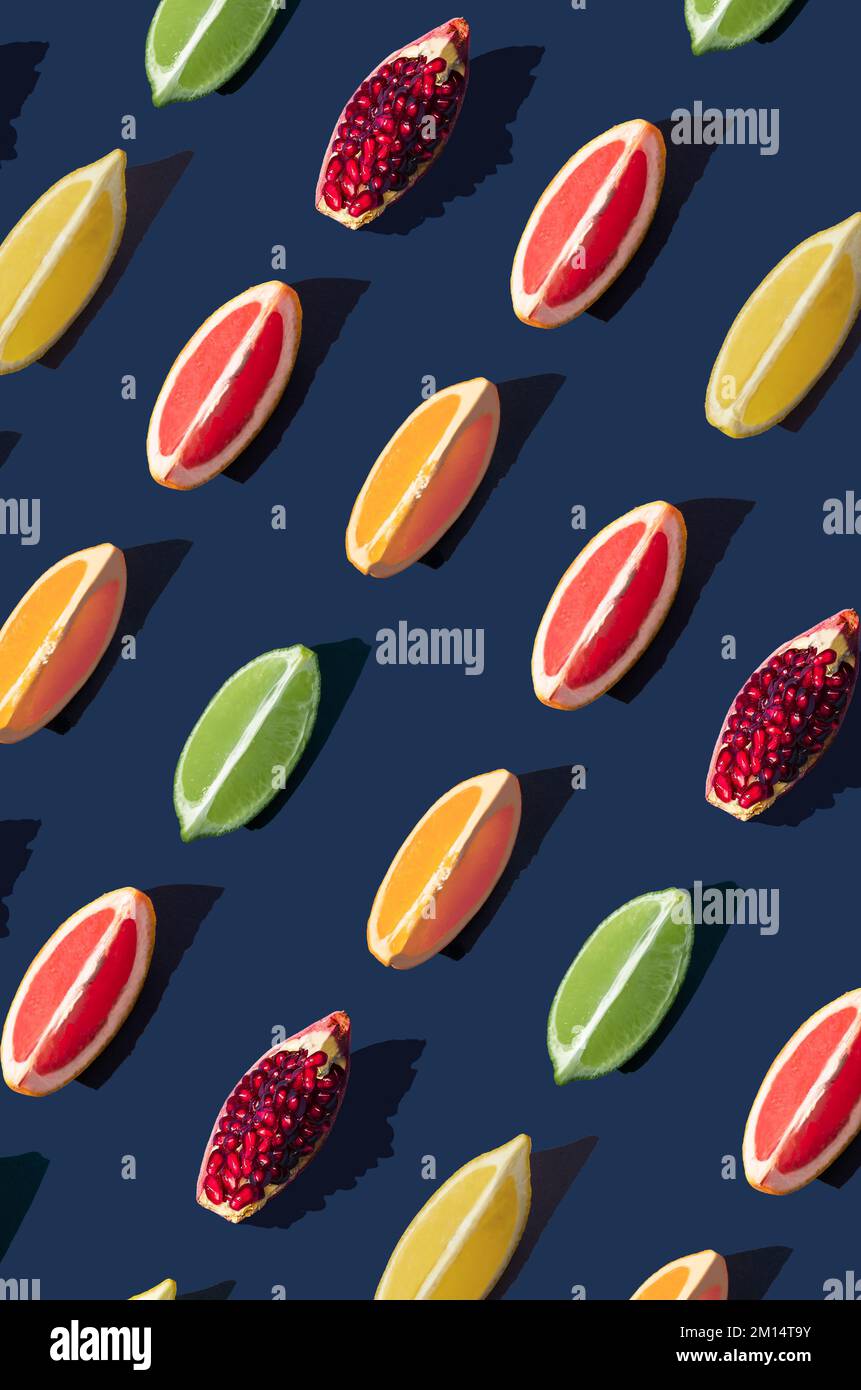 A vertical 3D rendered slices of summer citrus fruits on a blue ...