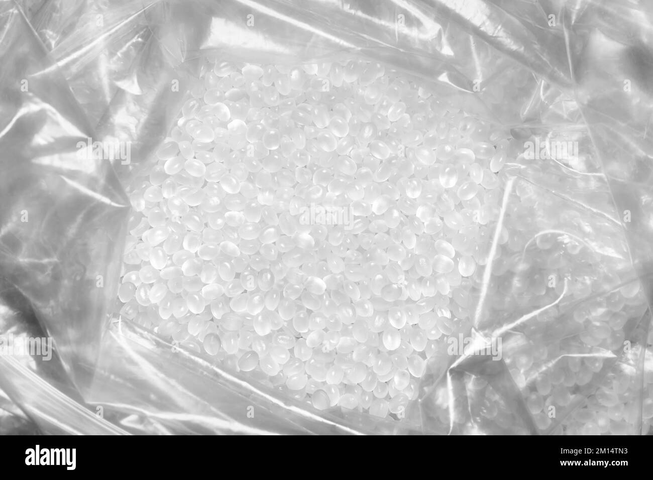 Close up picture of polypropylene granules in a plastic bag, selective ...