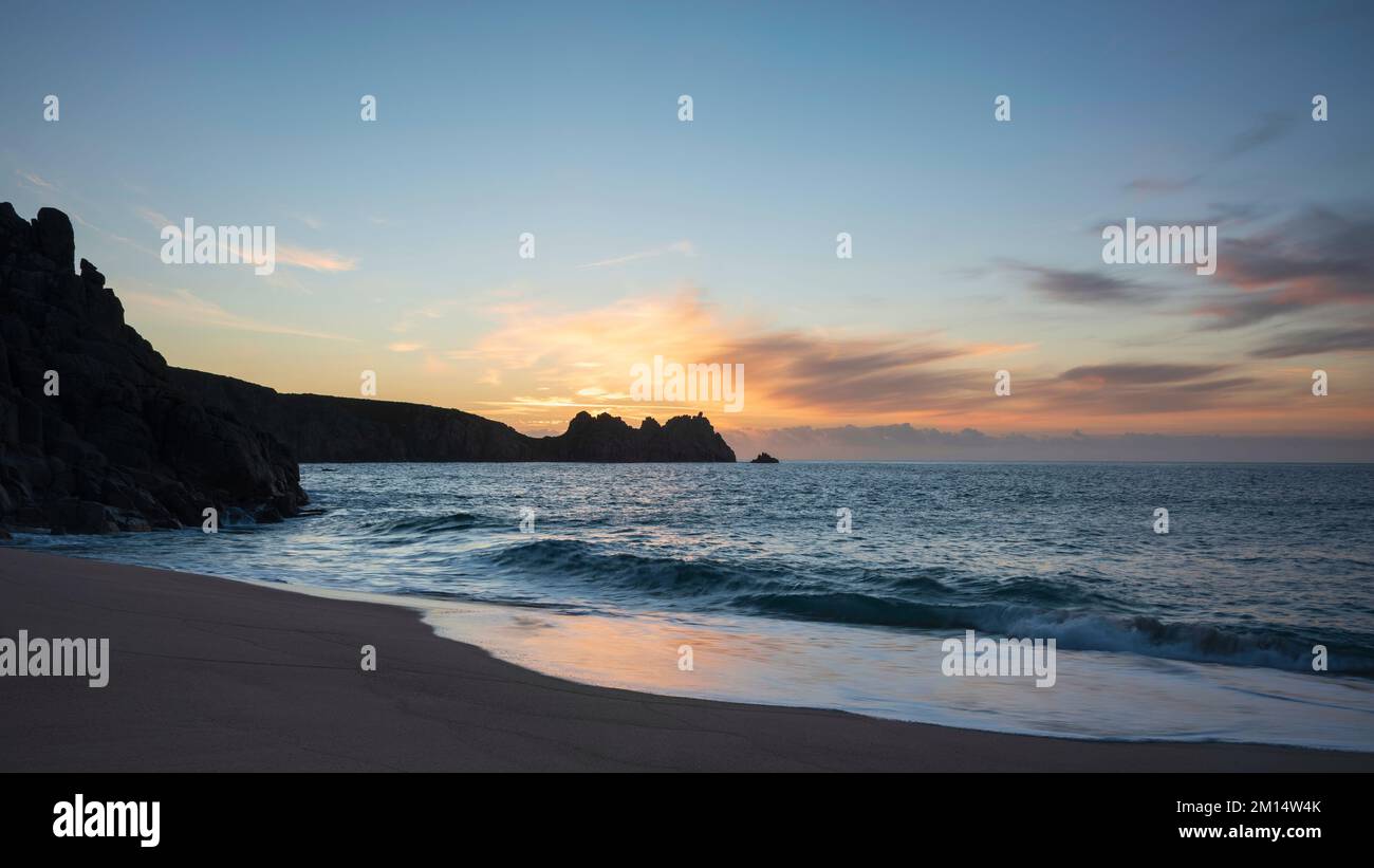 Beautiful sunrise landscape at Porthcurno beach in Cornwall England ...