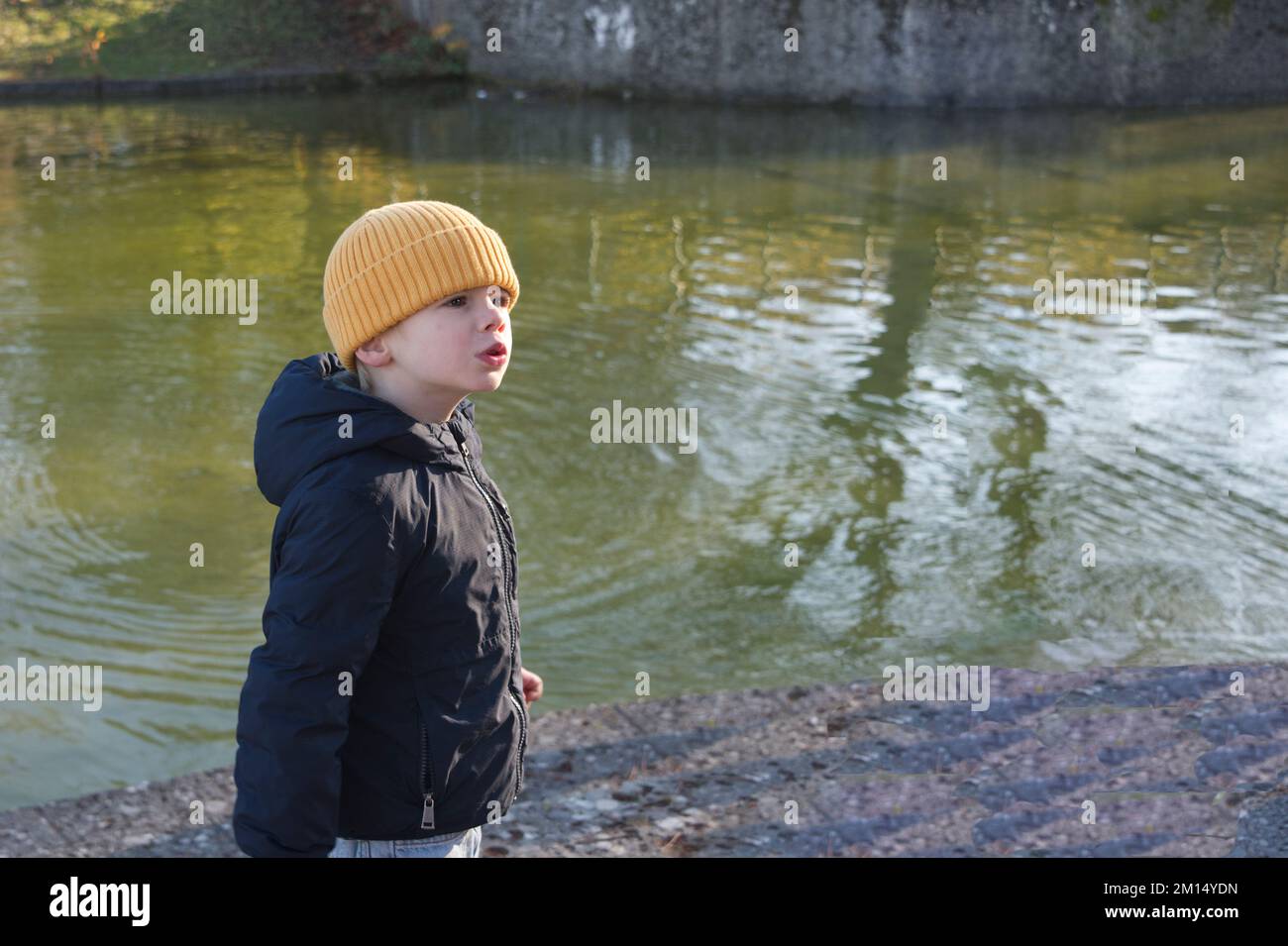Near view of a young child at the playground on a sunny day Stock Photo ...